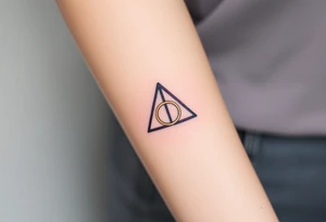 A delicate Deathly Hallows full symbol in thin gold lines in shades of ...